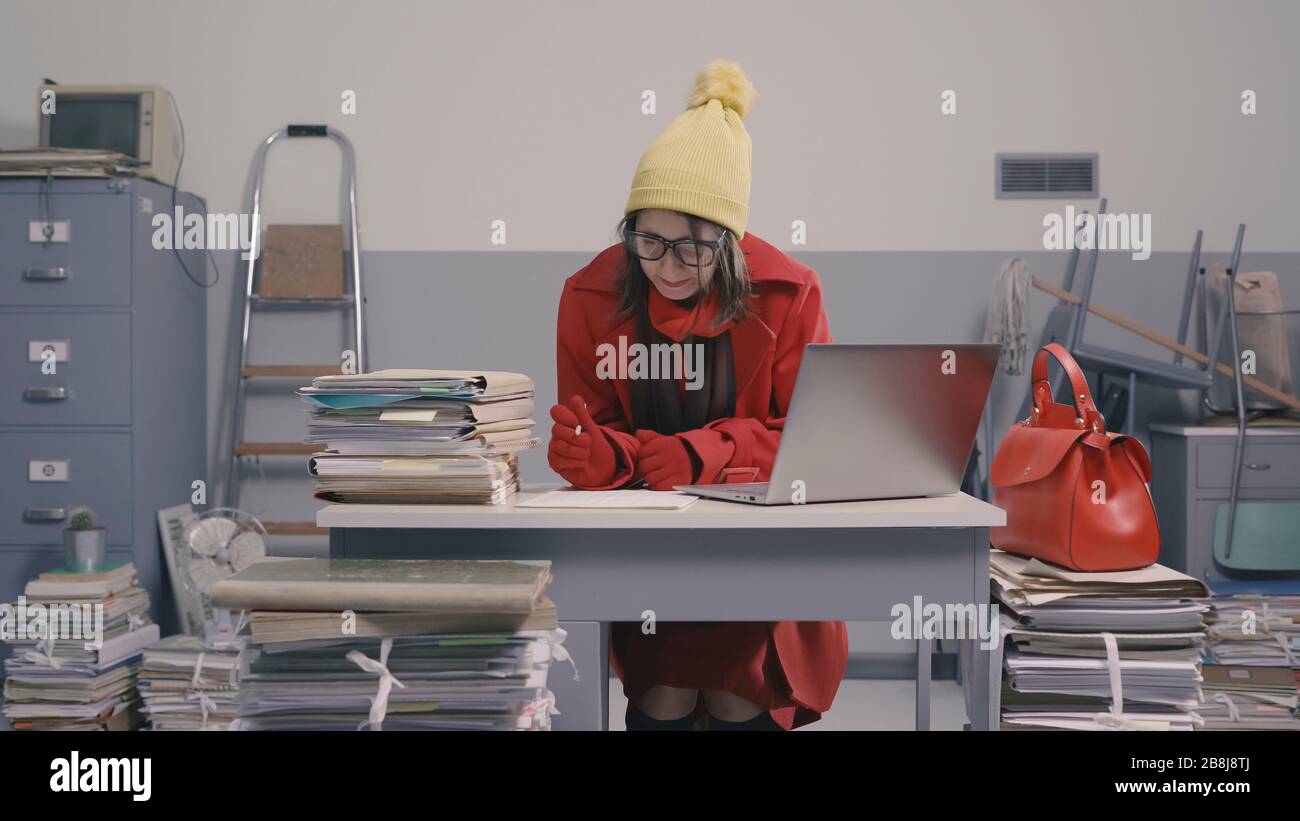 Freezing in a cold office hi-res stock photography and images - Alamy