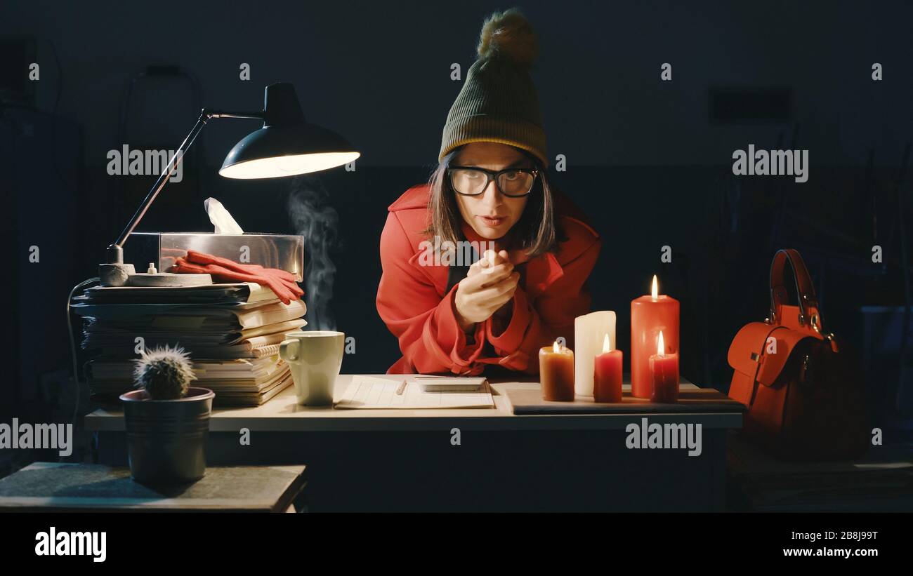 Woman freezing office hi-res stock photography and images - Alamy