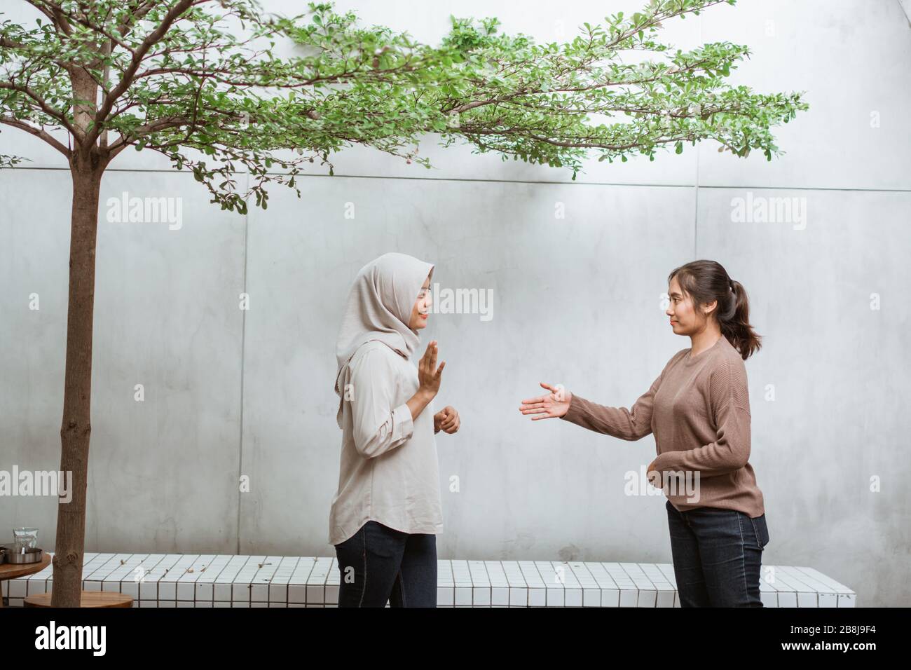 social distancing. woman refuse to touch while meeting Stock Photo - Alamy