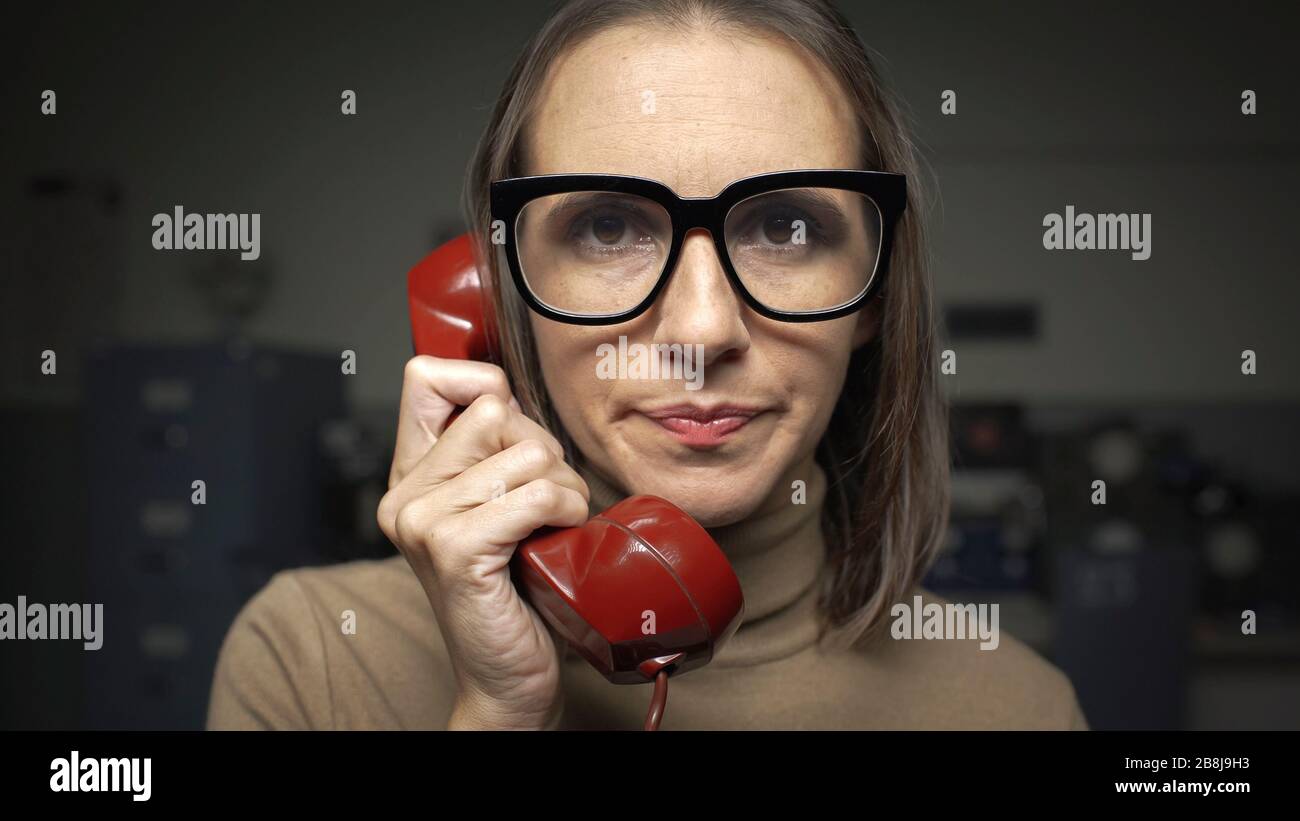 Disappointed woman with glasses having a boring phone call Stock Photo ...