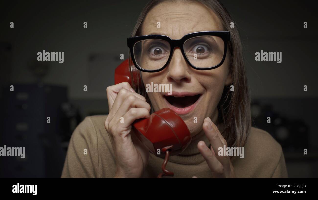 Scared panicked woman receiving shocking news on the phone Stock Photo ...