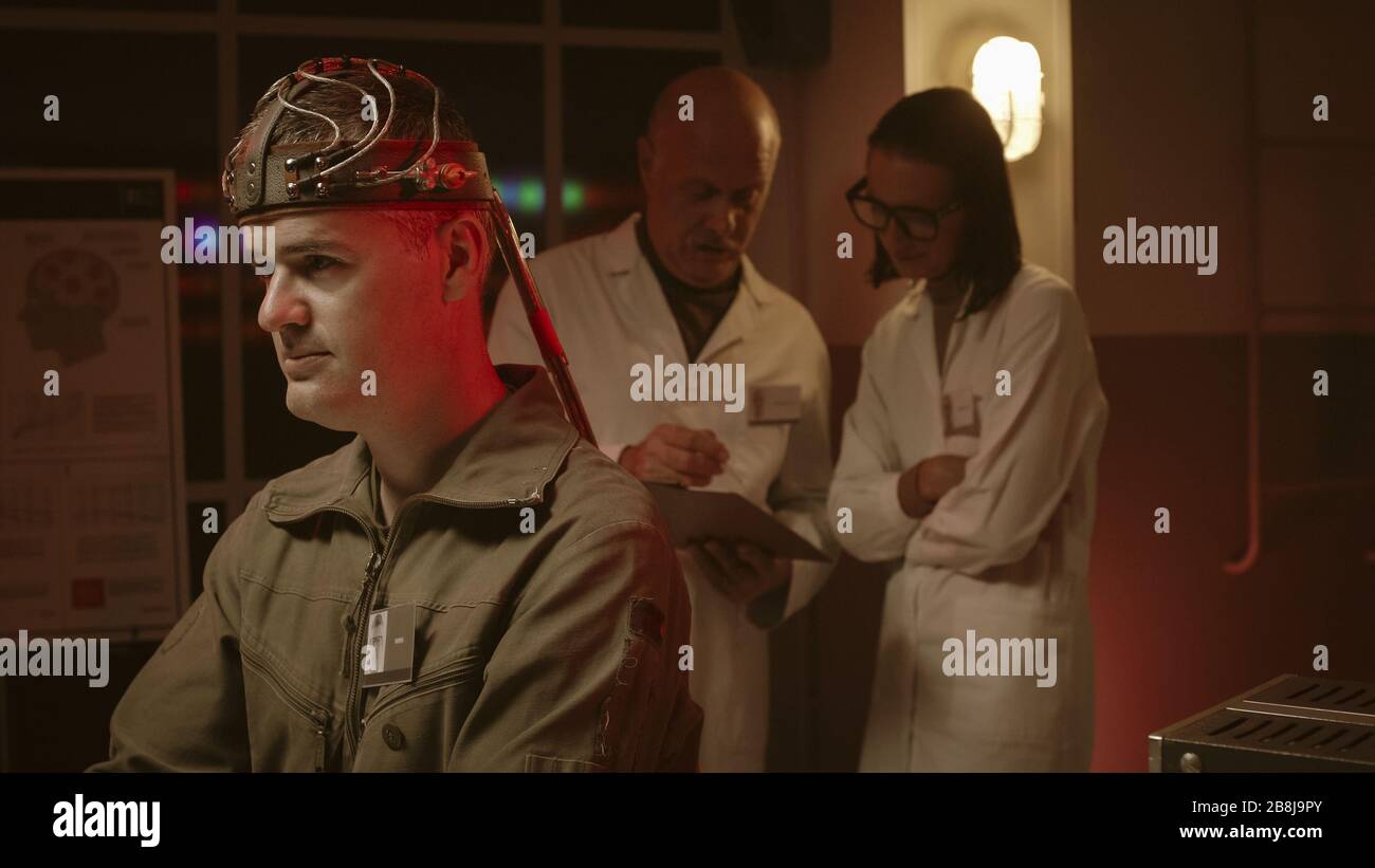 Scientists making experiments on a human brain in a vintage style lab ...
