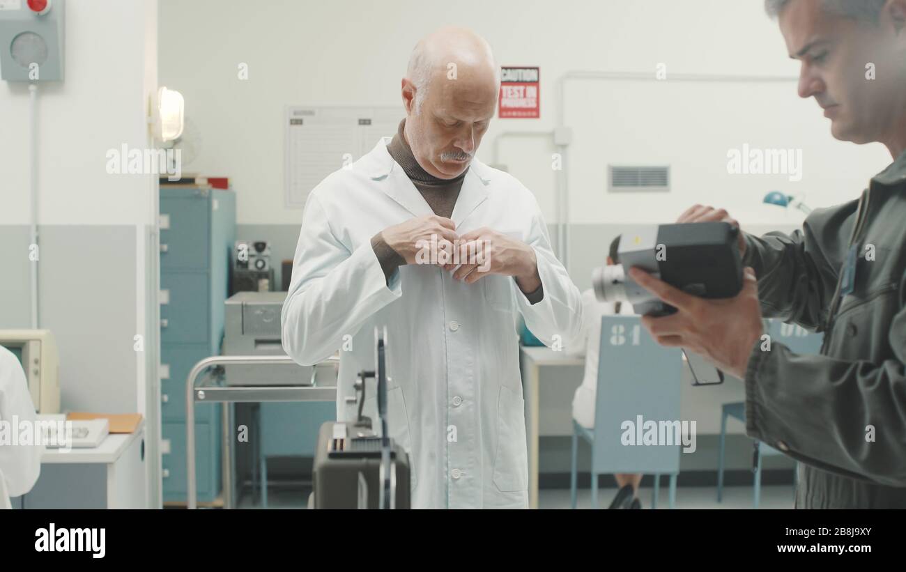 Chief scientist preparing for a video interview in the vintage style ...