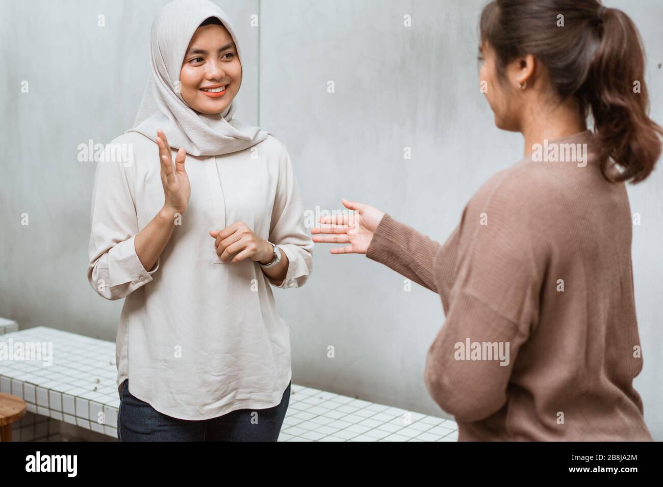 social distancing. woman refuse to touch while meeting with friend ...