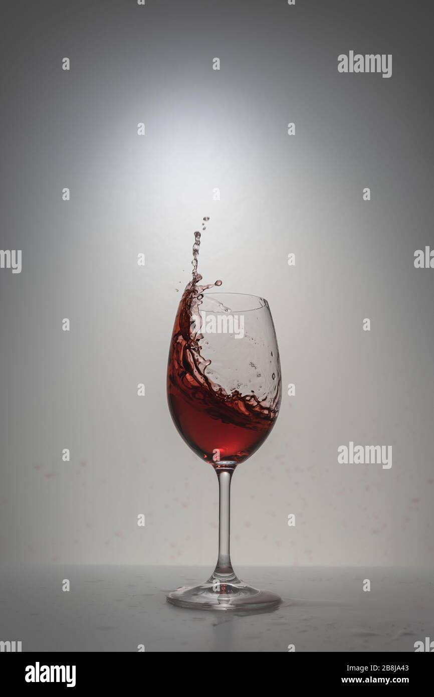 red wine splash in a red wine glass Stock Photo - Alamy