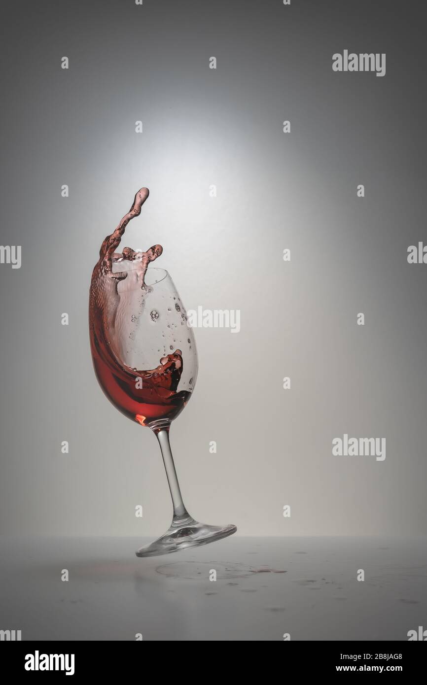 red wine splash in a red wine glass Stock Photo - Alamy