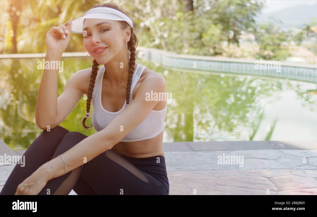 Sitting on poolside hi-res stock photography and images - Alamy