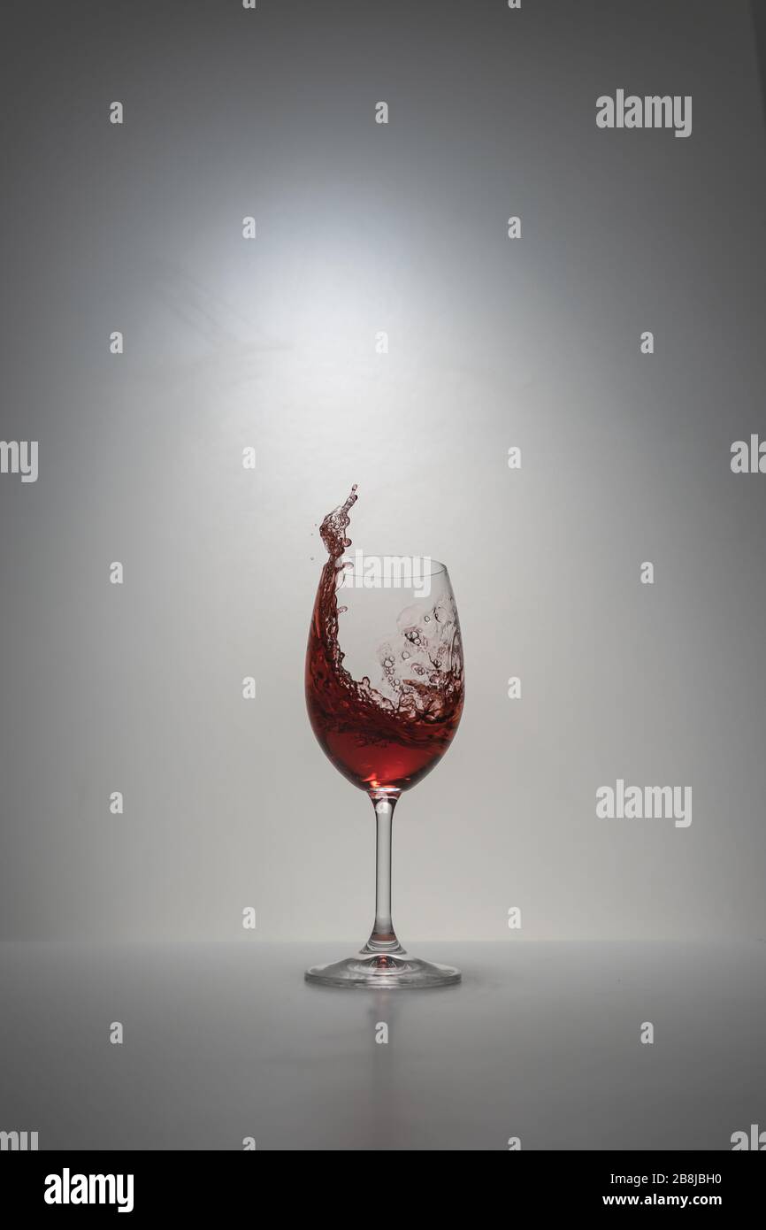 red wine splash in a red wine glass Stock Photo - Alamy