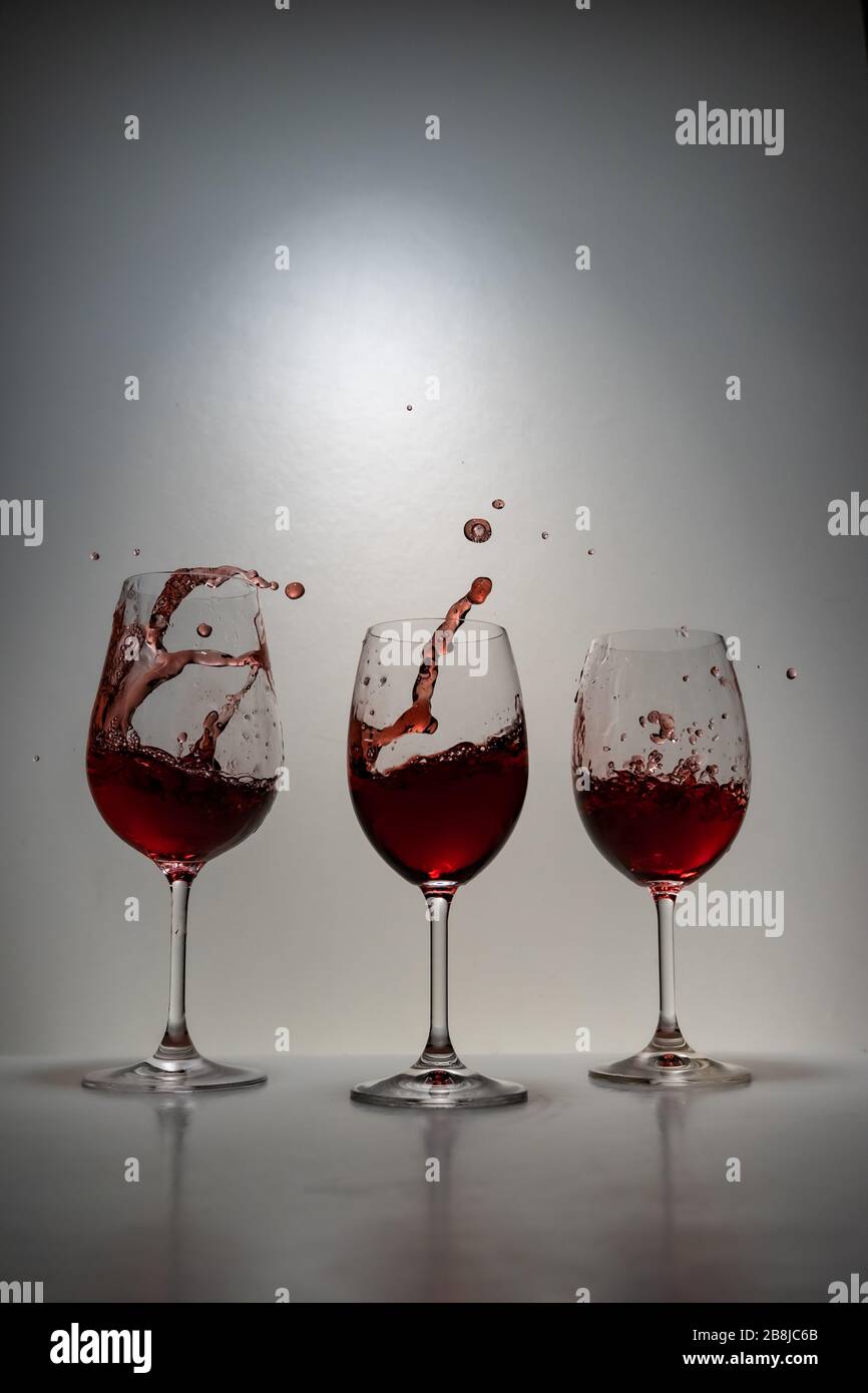 red wine splash in a red wine glass Stock Photo - Alamy