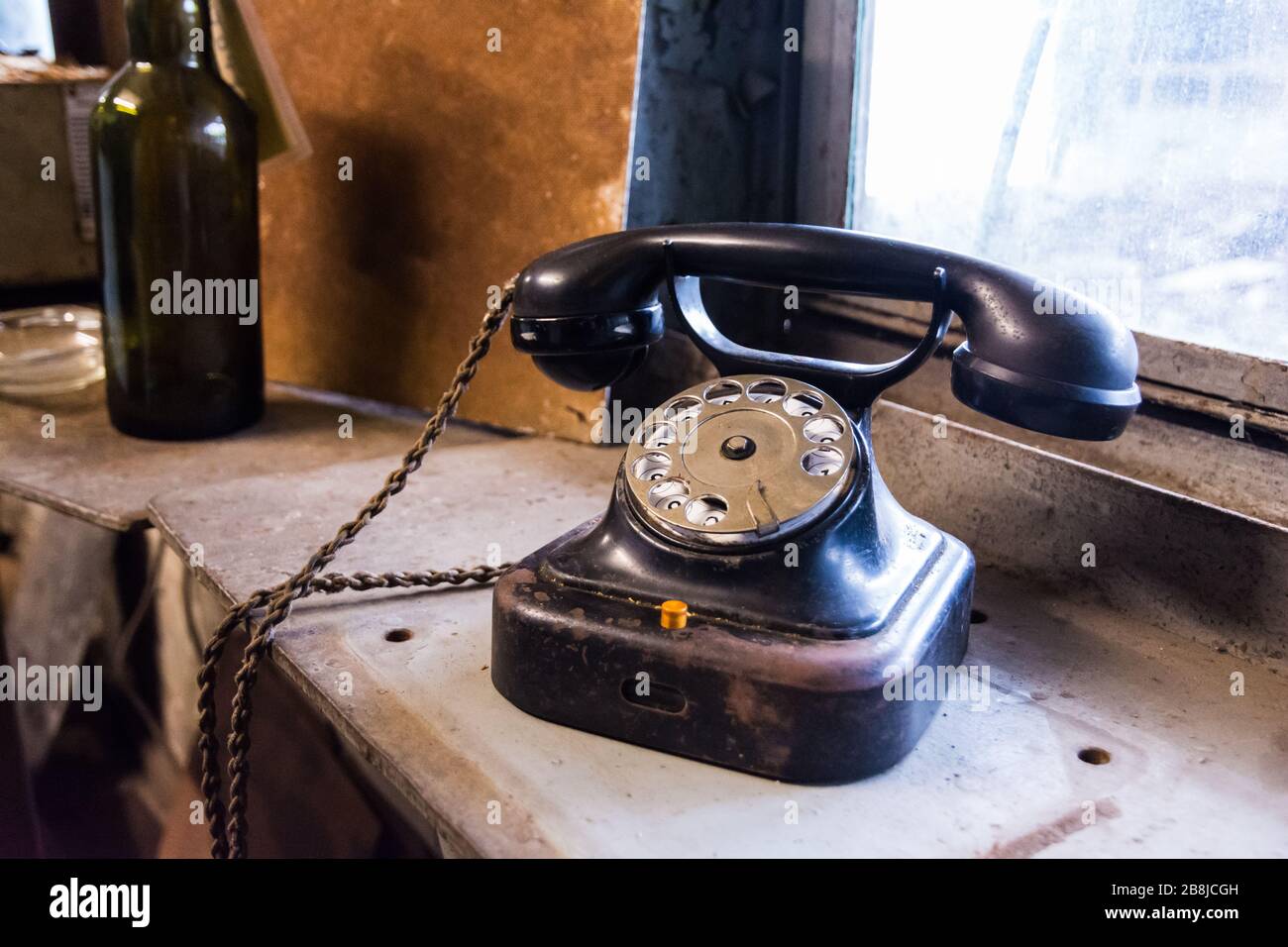 An old rotary phone in a workshop Stock Photo - Alamy
