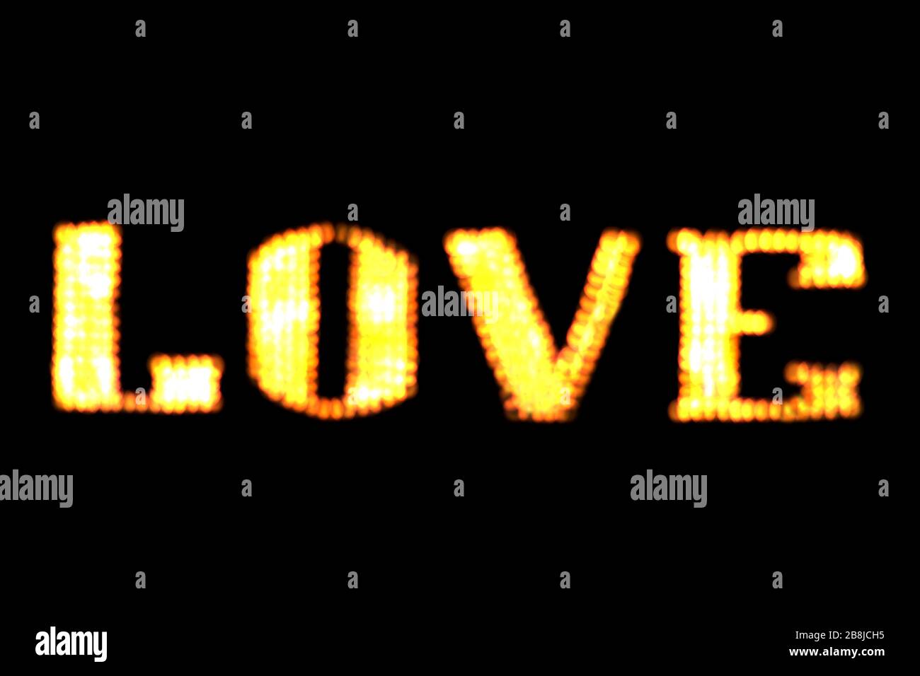 blurred text LOVE sign LED Bokeh light yellow gold on dark wall, Neon ...