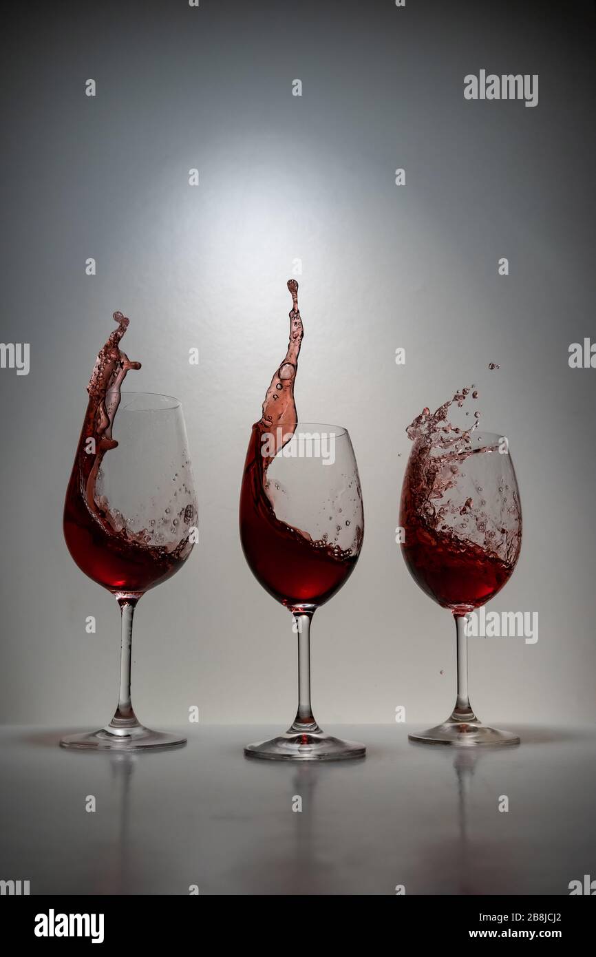 red wine splash in a red wine glass Stock Photo - Alamy
