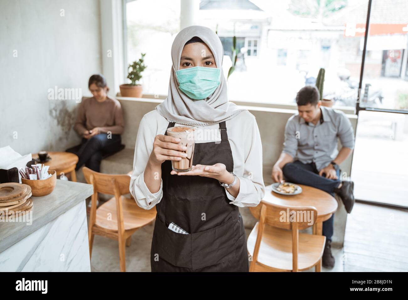 muslim worker wearing masks while working in coffee shop Stock Photo ...