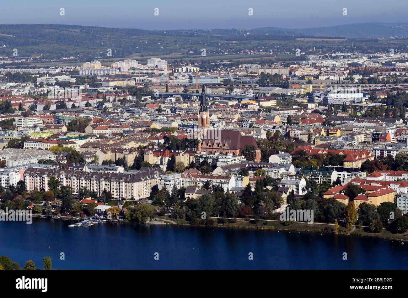 Austria, Vienna, Floridsdorf district with church and Alte Donau lake ...