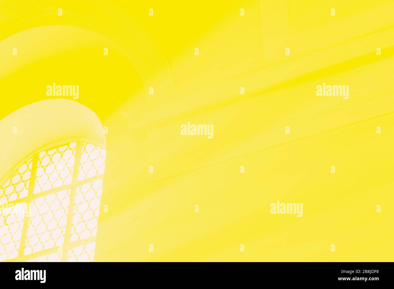 Light rays through the window. Yellow toned photo Stock Photo - Alamy