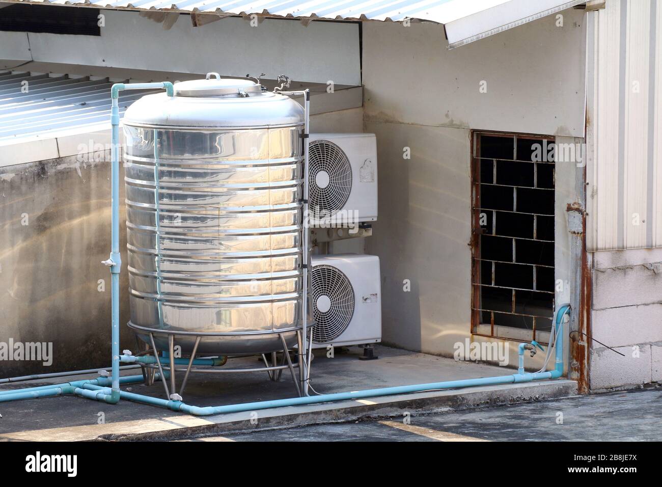Stainless steel water tank on the building deck Stock Photo - Alamy