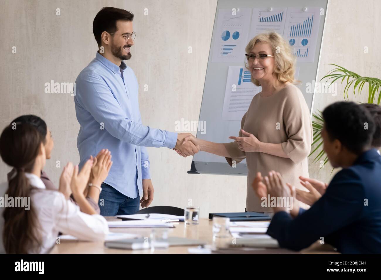 Happy businesswoman handshake greeting employee with promotion Stock ...