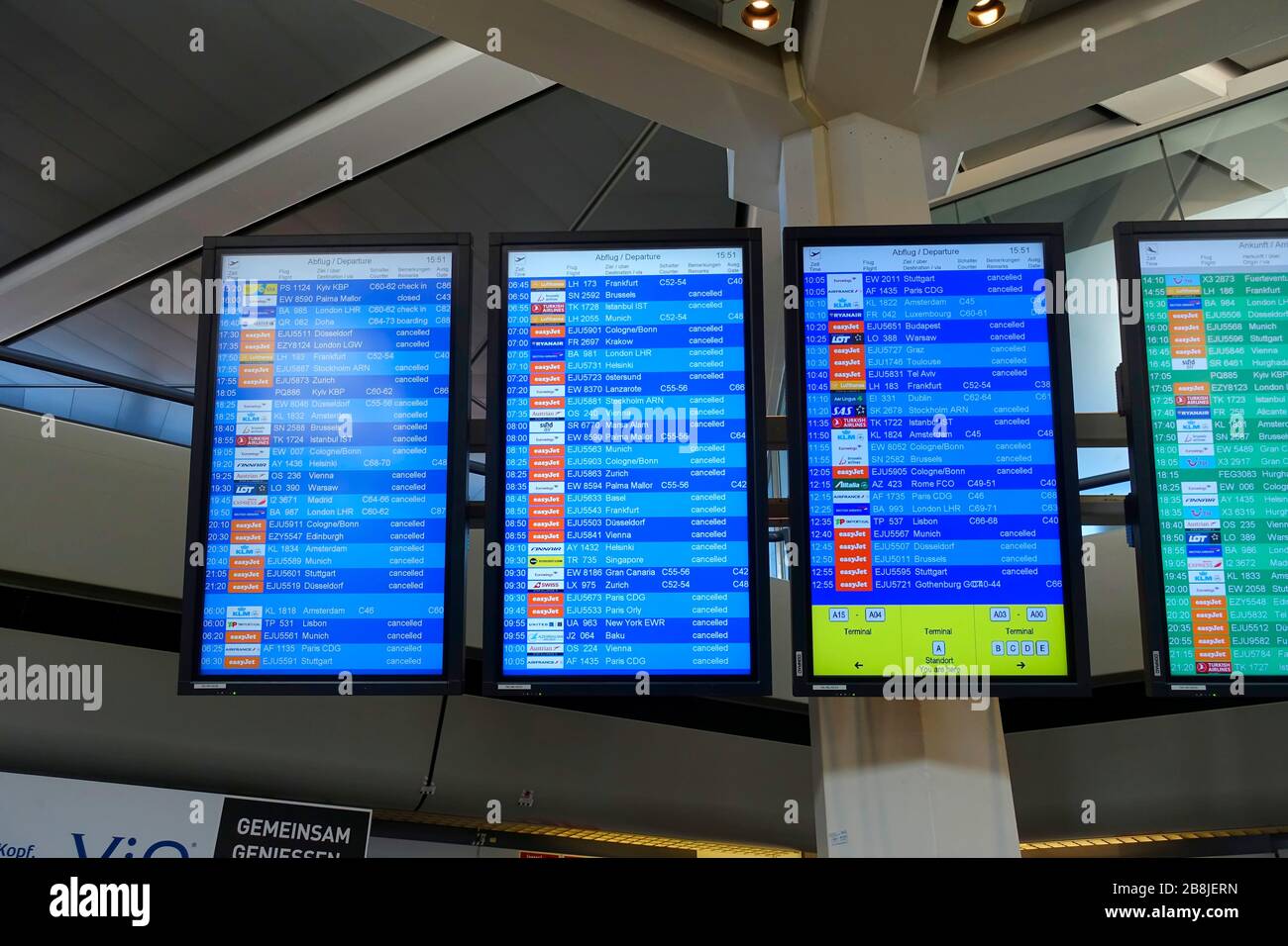 Airport display announcing cancelled flights Stock Photo - Alamy