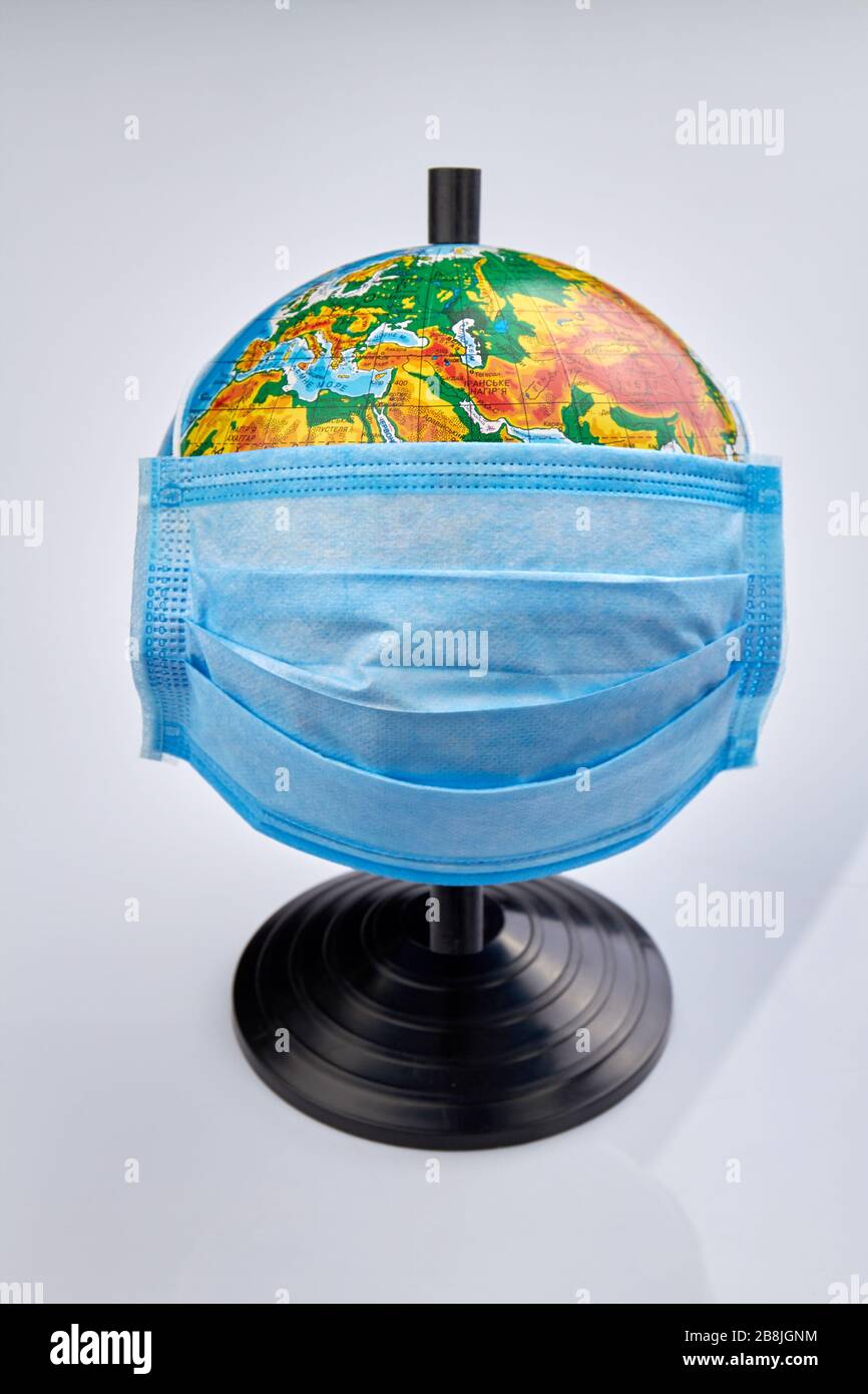 Earth globe respiratory protective mask Stock Photo - Alamy