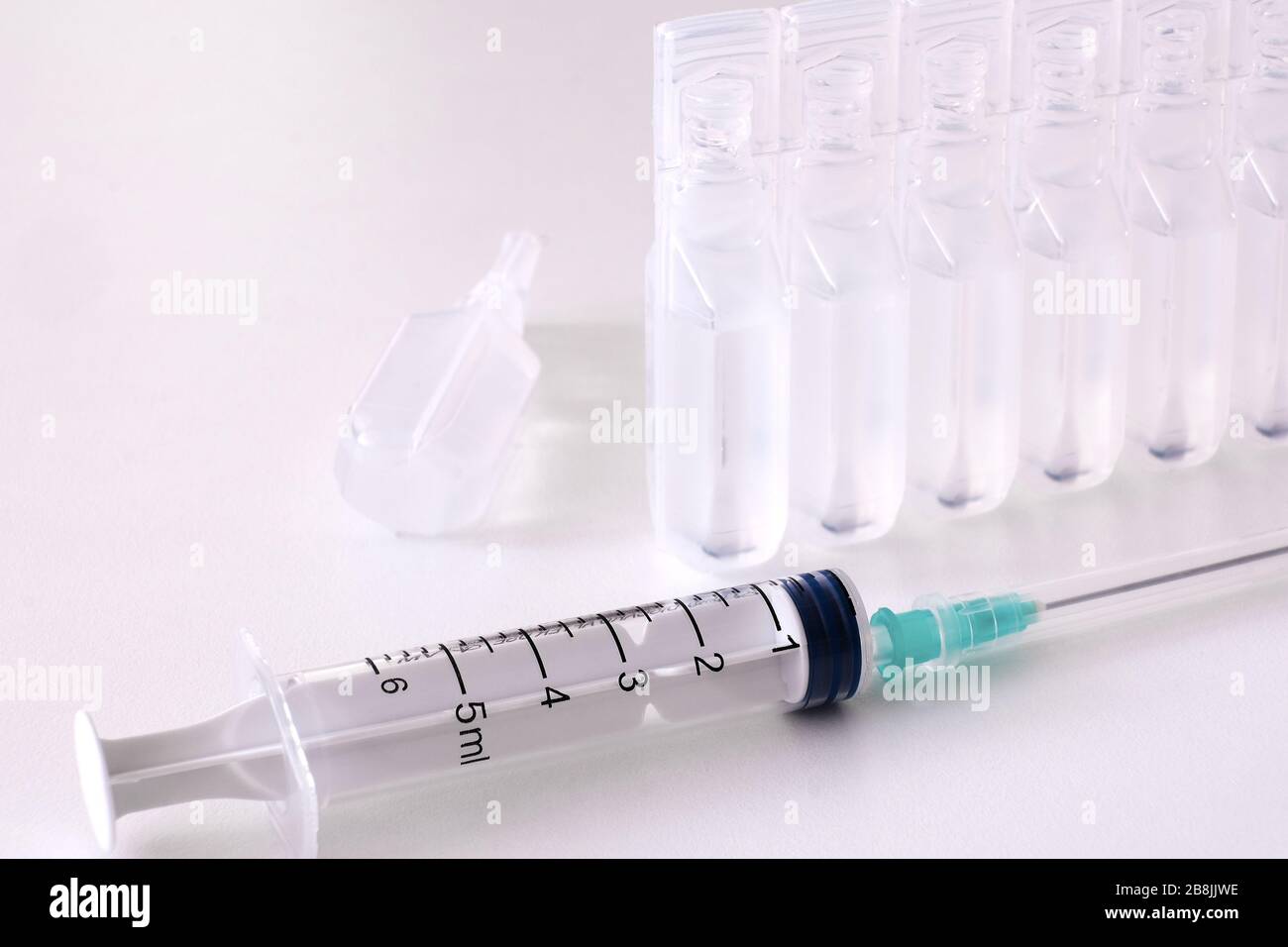 Syringes, water for injection, vials of vaccine. The concept of ...
