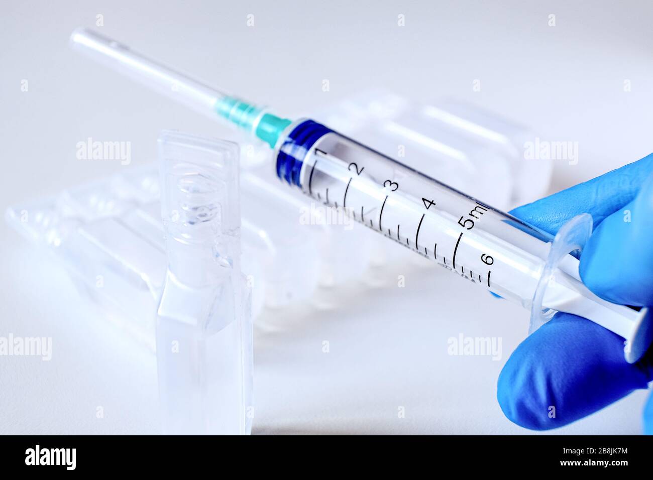 Syringes, water for injection, vials of vaccine. The concept of ...