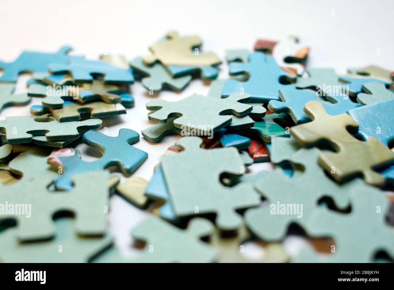 Blue puzzle pieces on white background Stock Photo - Alamy
