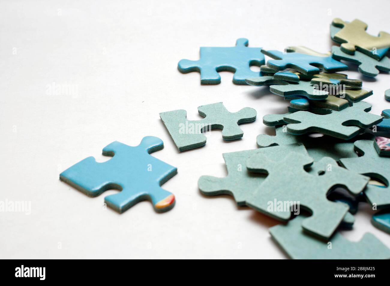Blue puzzle pieces on white background Stock Photo - Alamy