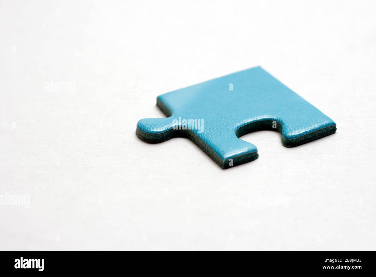Blue puzzle pieces on white background Stock Photo - Alamy