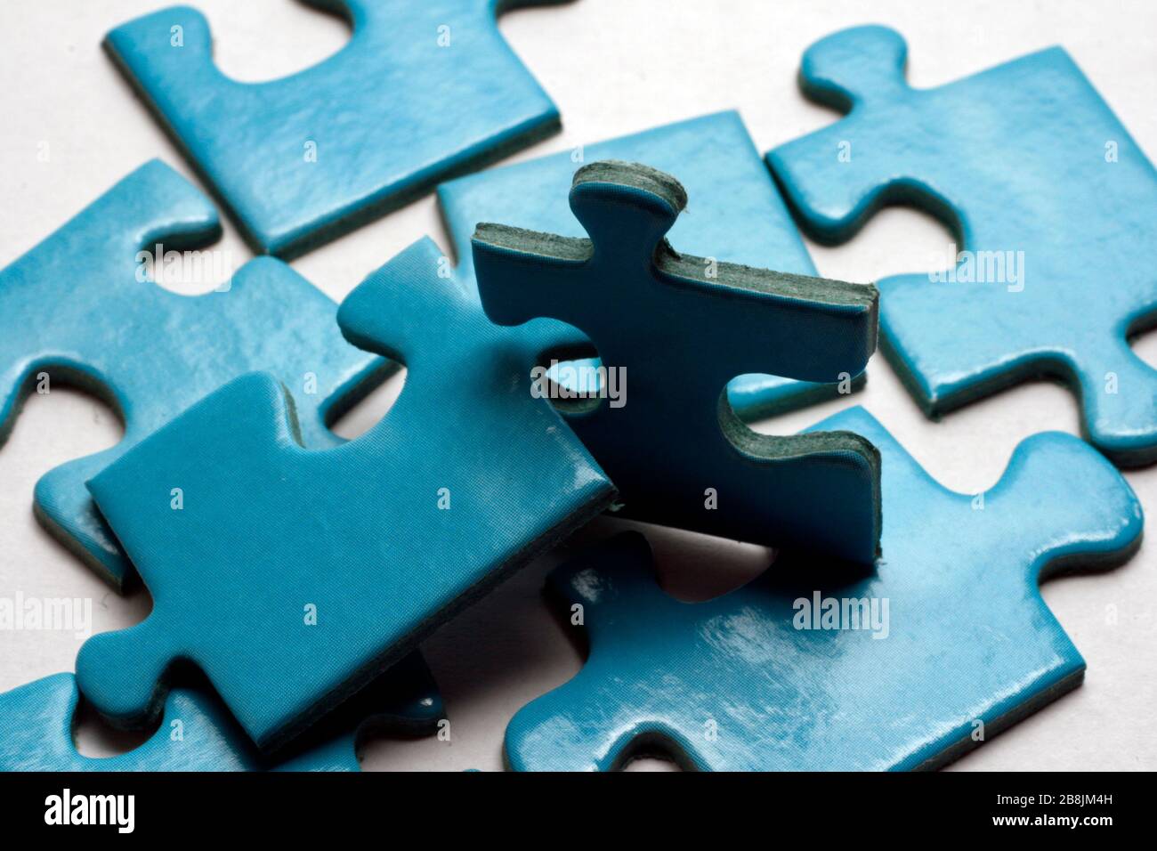 Blue puzzle pieces on white background Stock Photo - Alamy