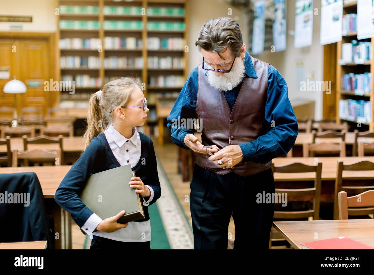 Librarian Holding Books Standing In High Resolution Stock Photography ...