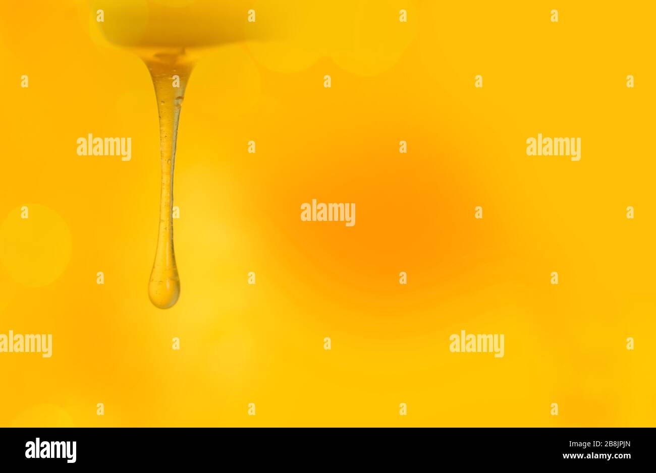 Organic sweet honey splashes. Honey dripping with honey dipper. Honey ...