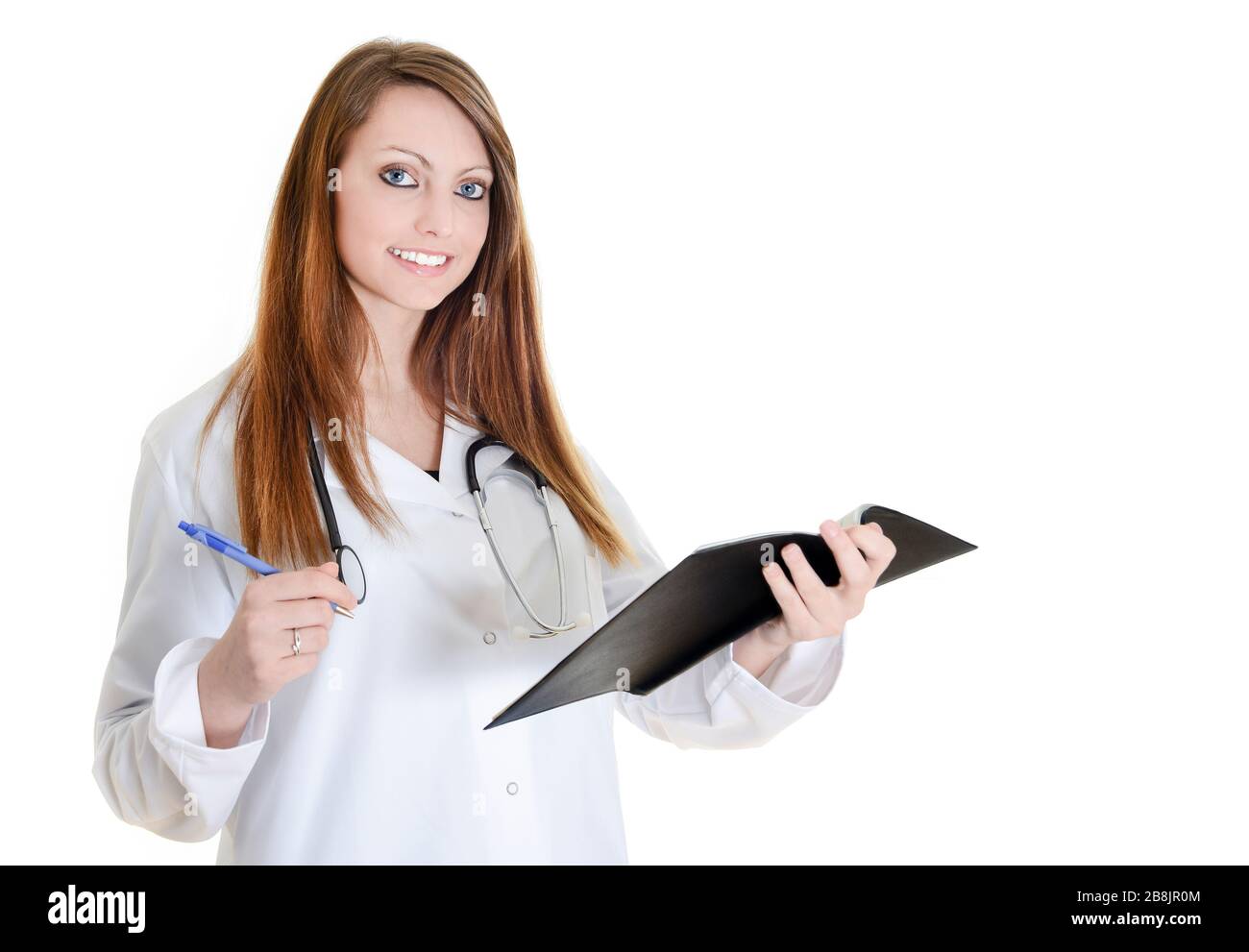 Pretty female doctor isolated writing on schedule Stock Photo - Alamy