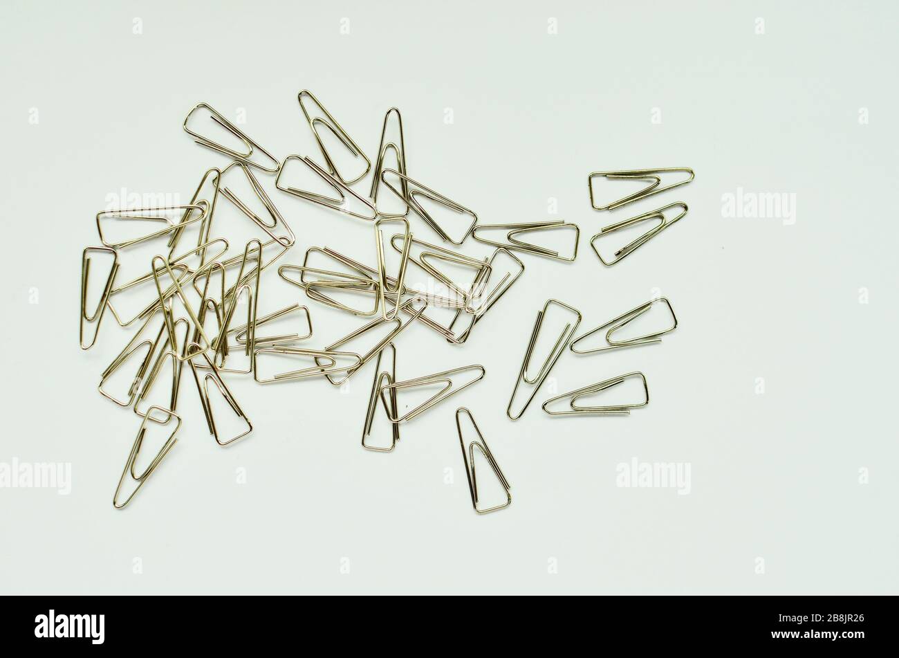 Paper clip in white background Stock Photo - Alamy