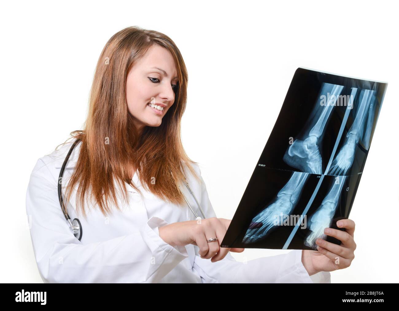female doctor with x-ray in hand over a white background Stock Photo ...