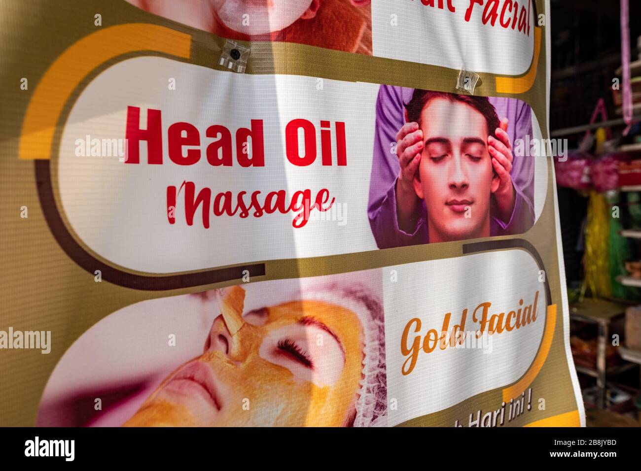 A sign advertising massage treatments in Malaysia Stock Photo - Alamy