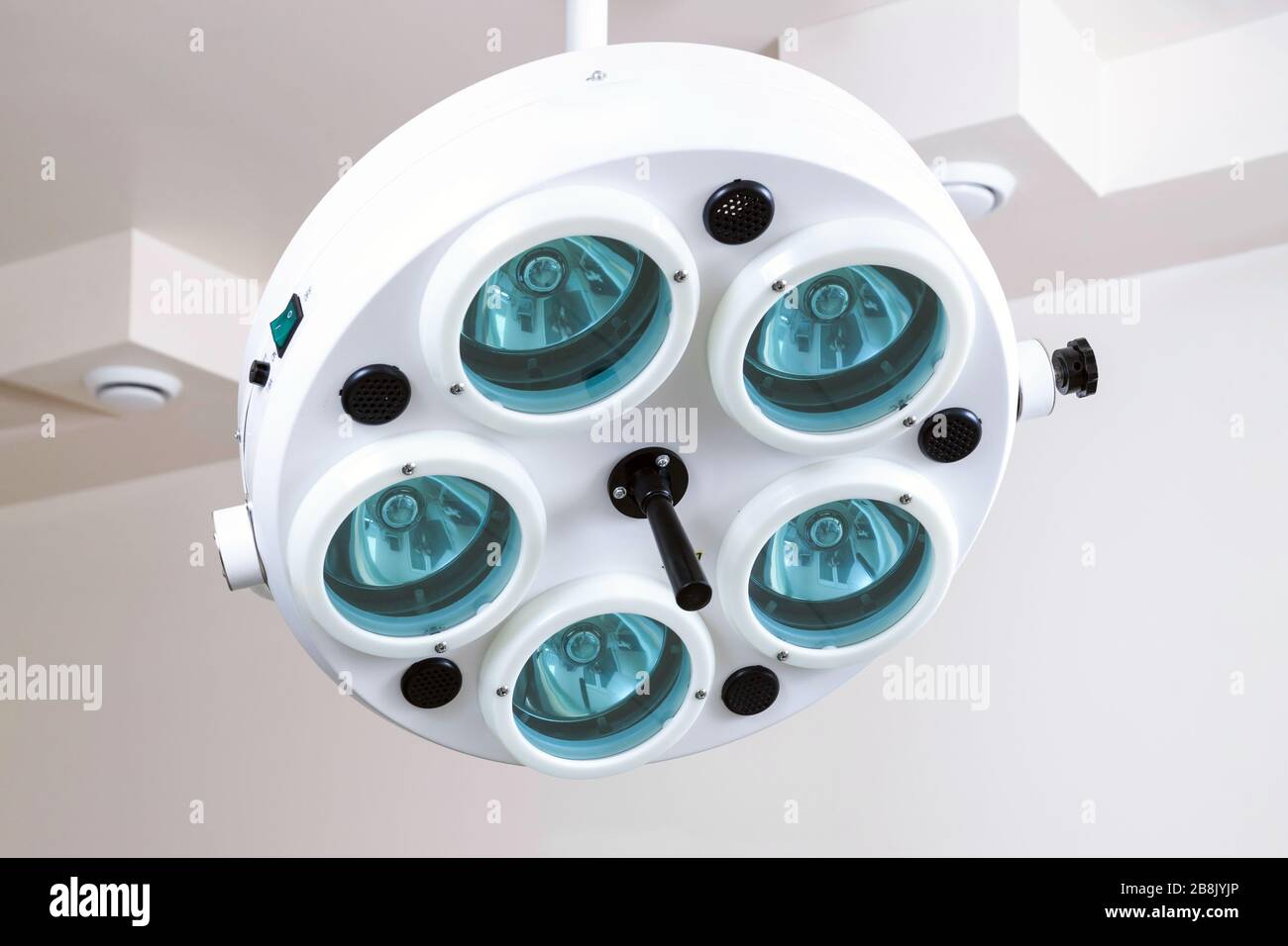 Lighting fixture in dental clinic on white background. LED illuminator ...