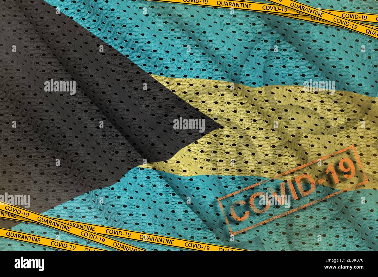 Bahamas flag and Covid-19 biohazard symbol with quarantine orange tape ...