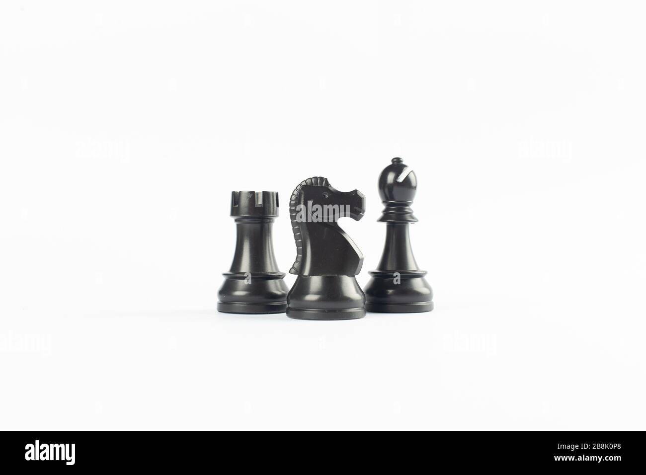 Black rook, queen and bishop isolated on white background Stock Photo ...