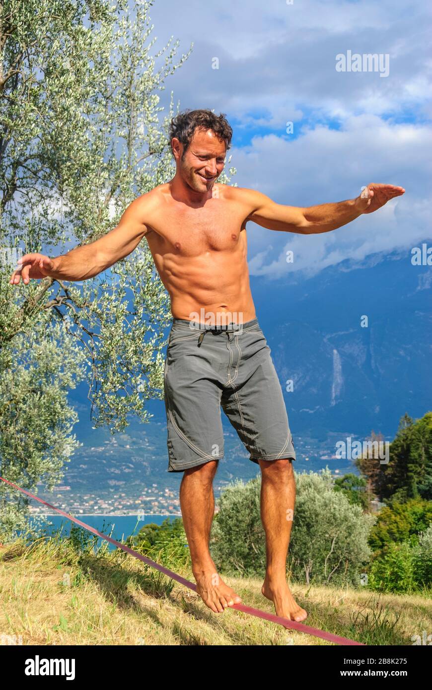 Man balancing on Slackline Stock Photo - Alamy
