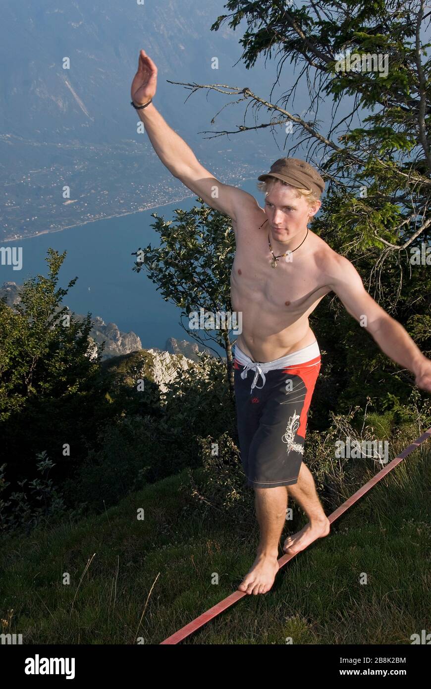 Man balancing on Slackline Stock Photo - Alamy