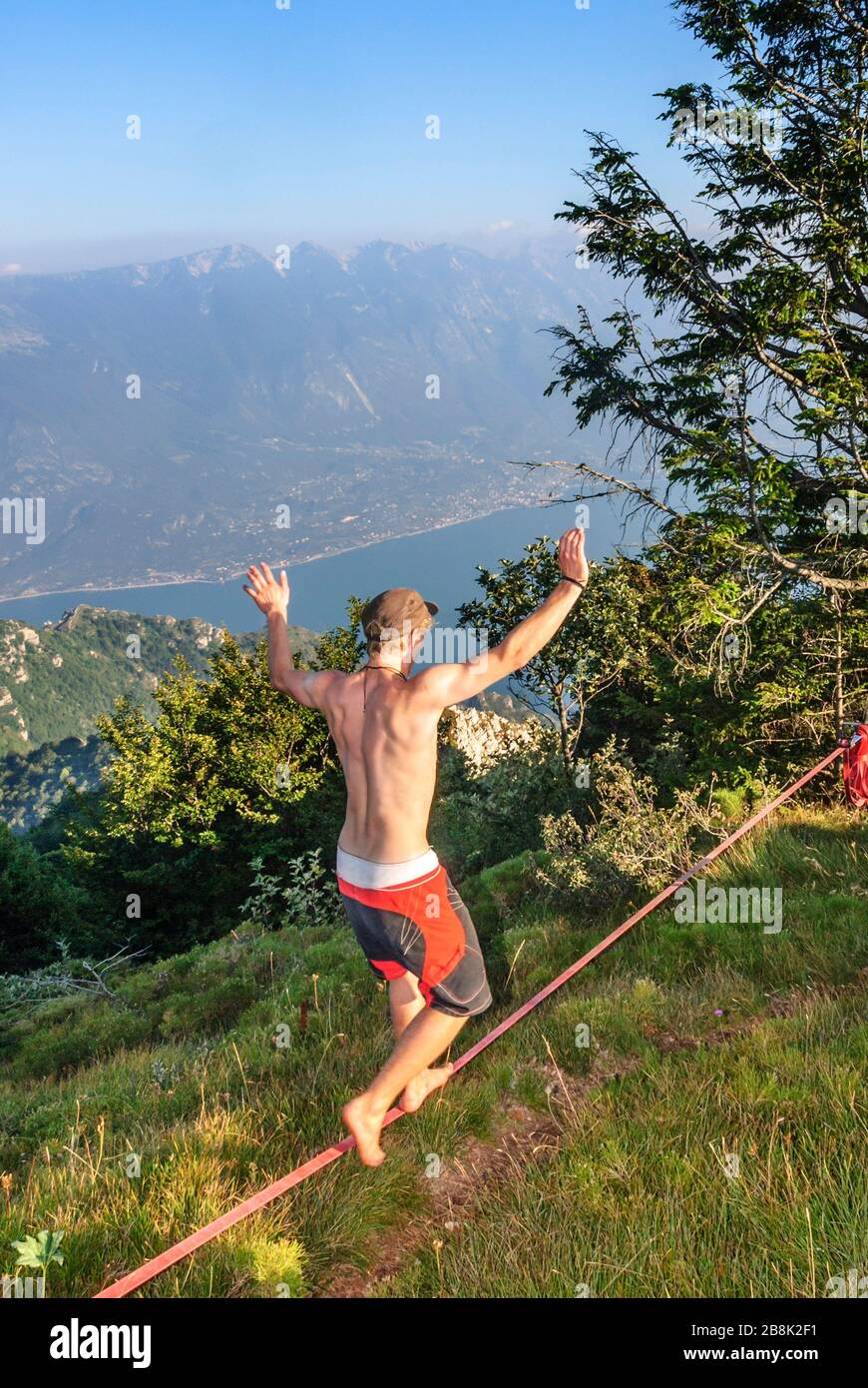 Man balancing on Slackline Stock Photo - Alamy