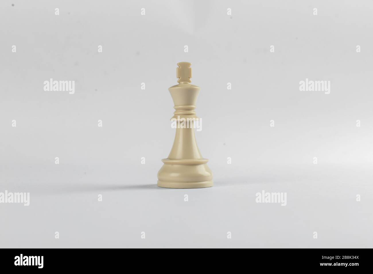 A white king isolated on white background Stock Photo - Alamy