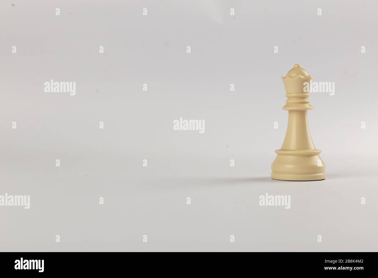 White single queen figure isolated on white background Stock Photo - Alamy