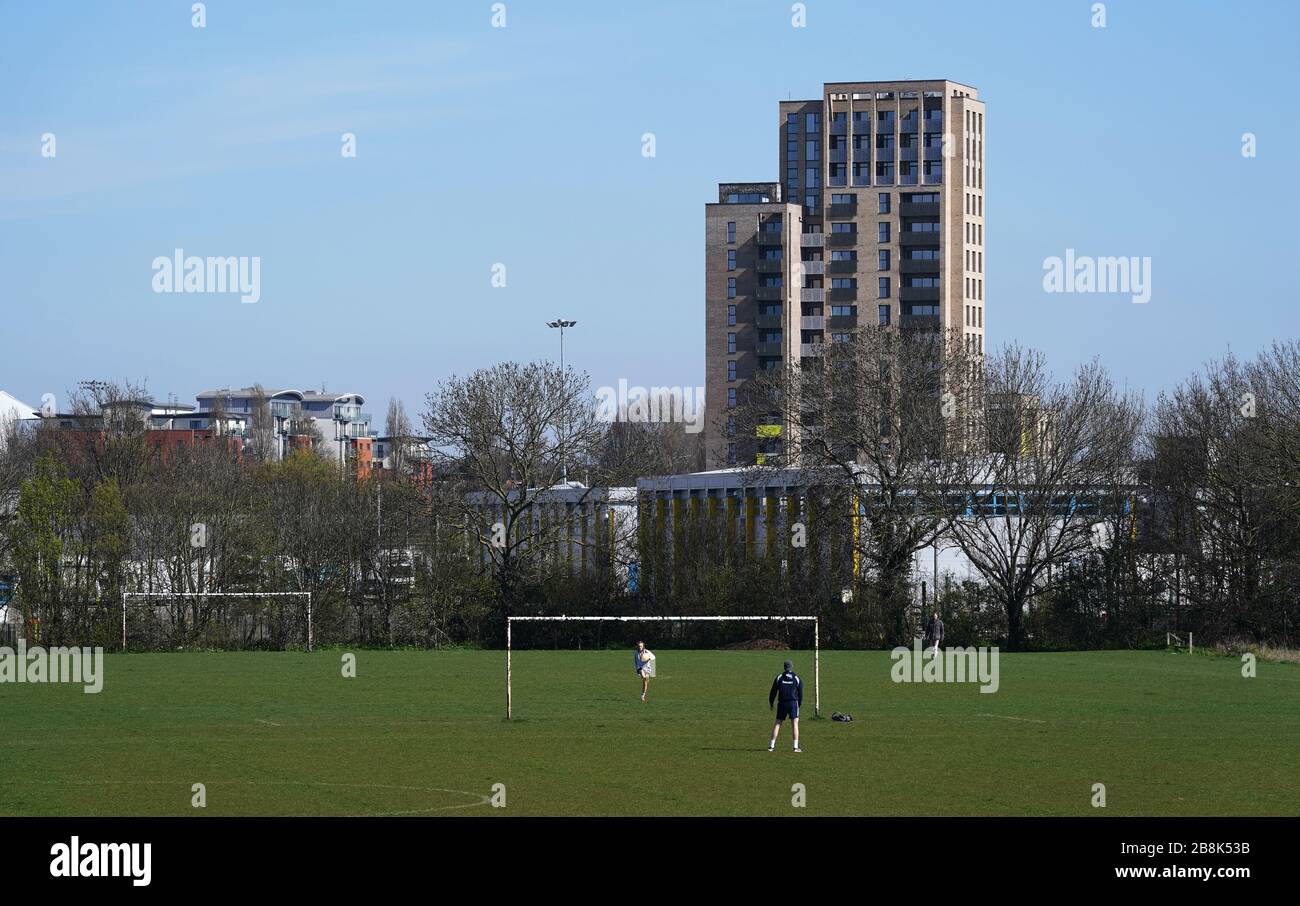People play football at Hackney Marshes in London, as all grassroots ...