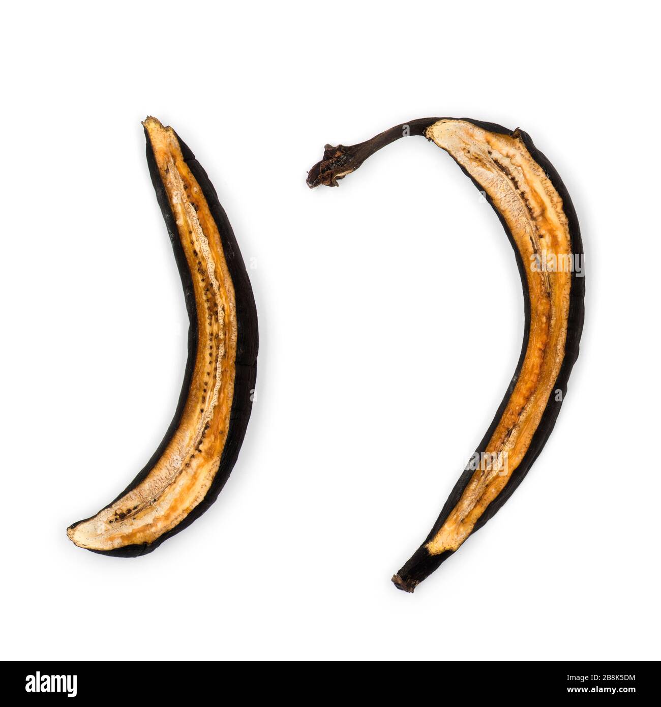 Decaying banana slices against white background Stock Photo - Alamy