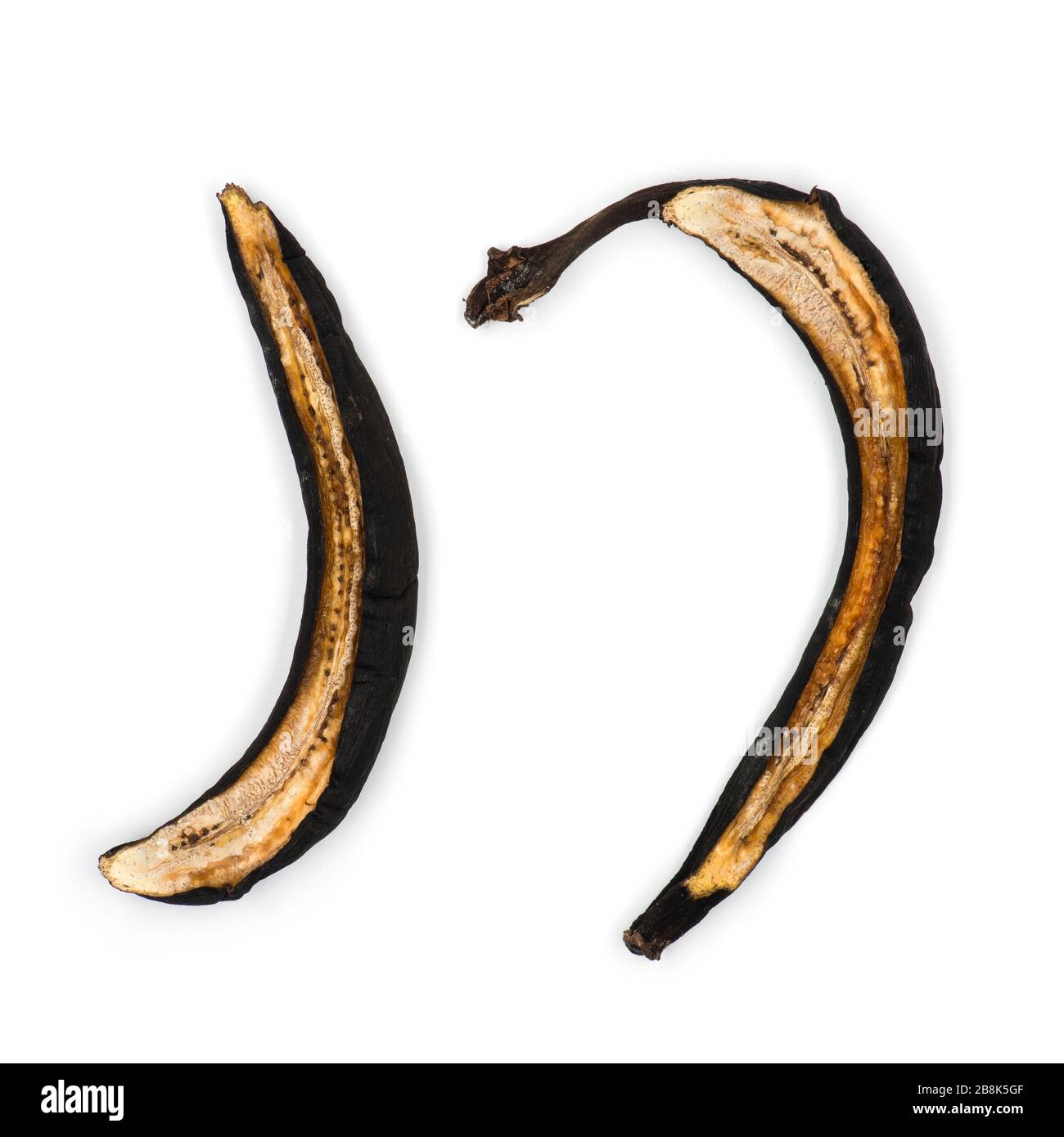 Decaying banana slices against white background Stock Photo - Alamy