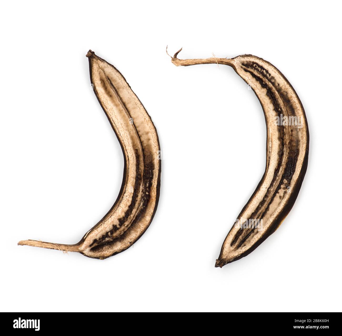 Decaying banana slices against white background Stock Photo - Alamy