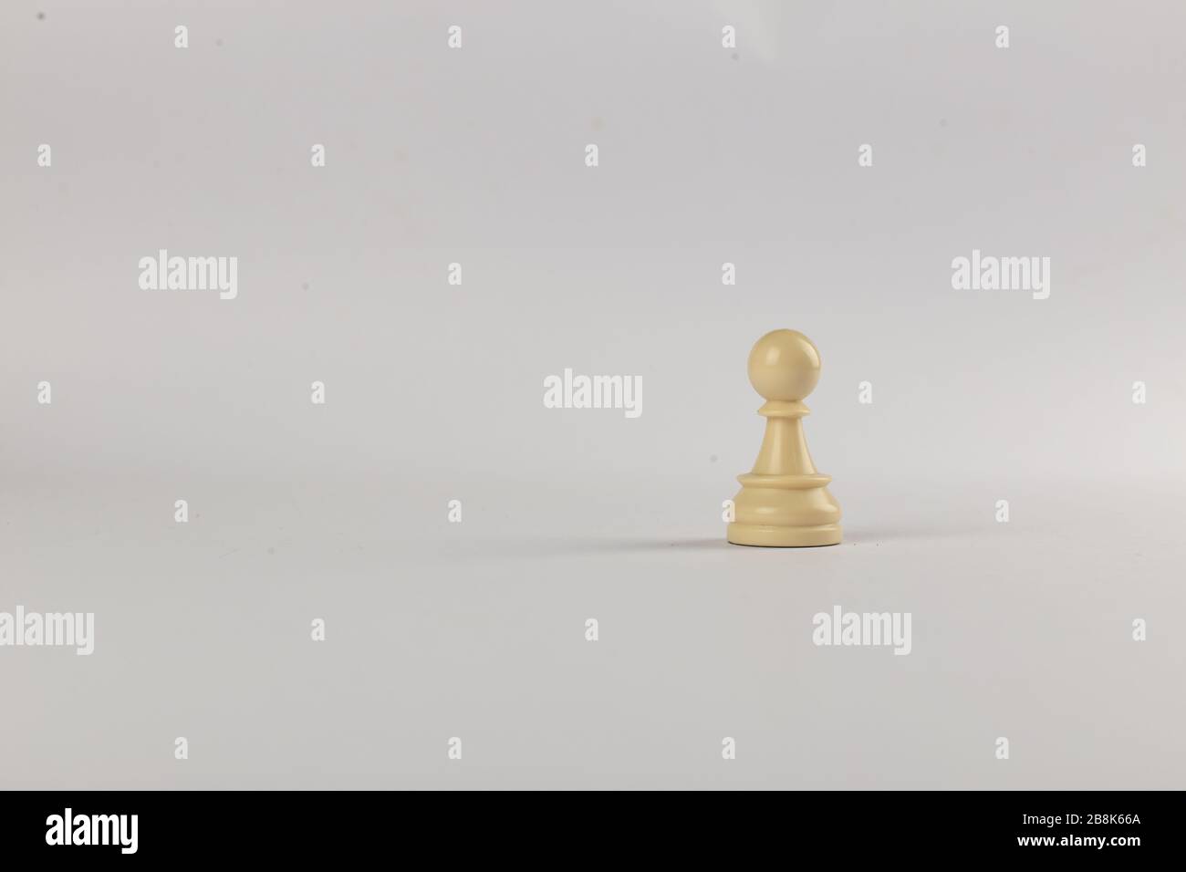 White single pawn figure isolated on white background Stock Photo - Alamy