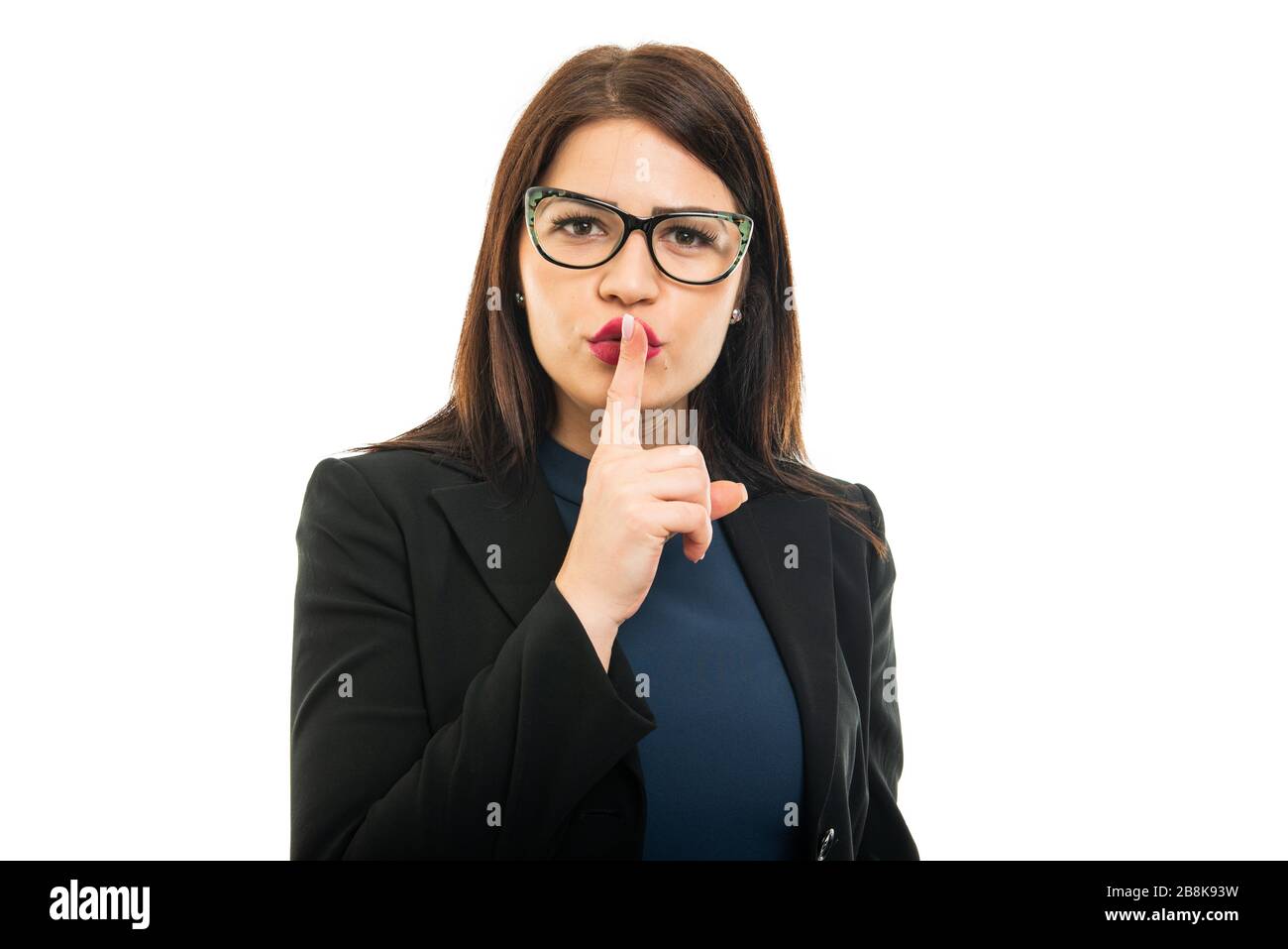 Portrait of young business girl making silence gesture isolated on ...