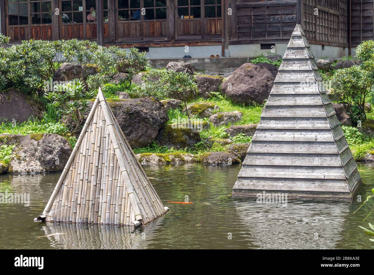 Triangular wooden objects in ornamental pond , near the Iya Kazurabashi ...